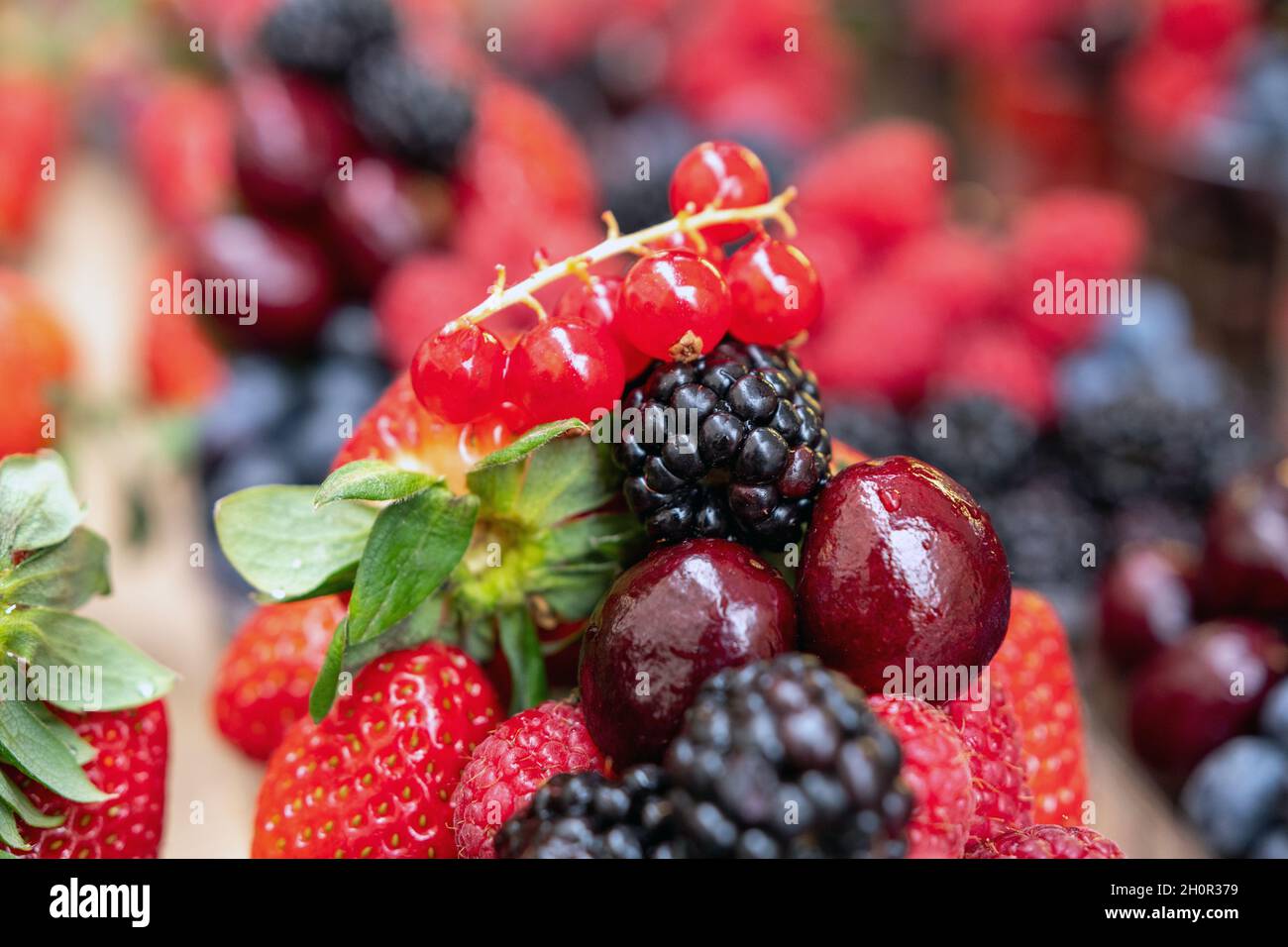 View of different sweet fruits on market Stock Photo - Alamy