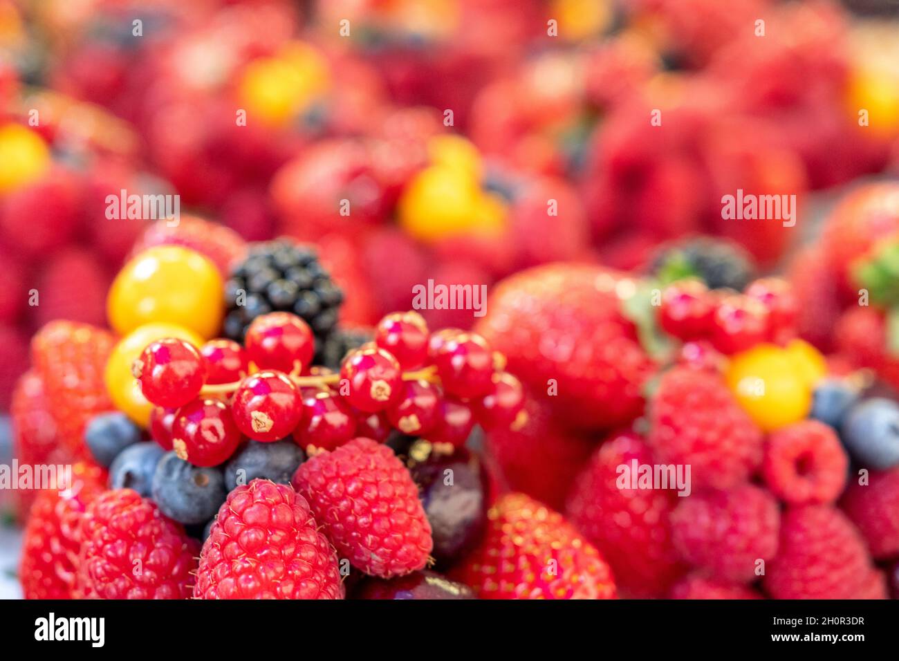 View of different sweet fruits on market Stock Photo - Alamy