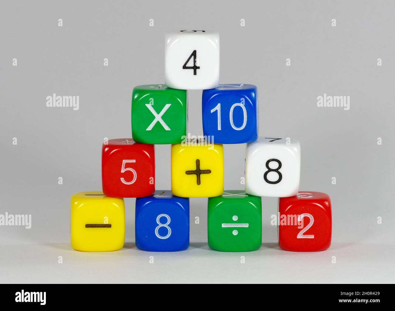 Stack of coloured dice with numbers and math signs Stock Photo - Alamy