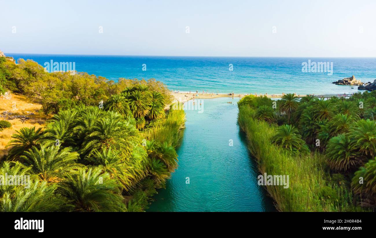 Panorama of Preveli beach at Libyan sea, river and palm forest ...