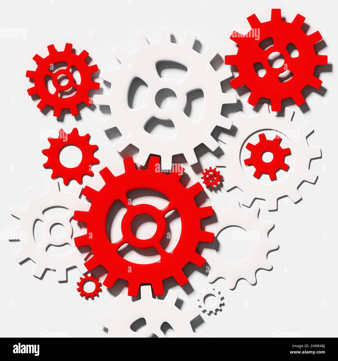 Red and white connecting gear cogs of various sizes isolated on white ...