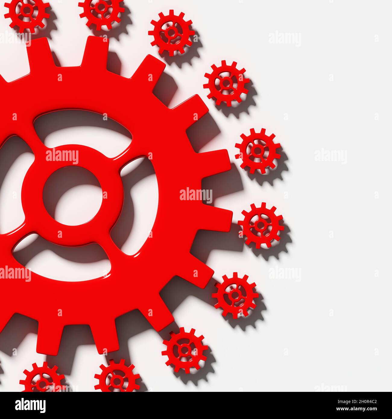 Close up of single red cog isolated on white background with several ...