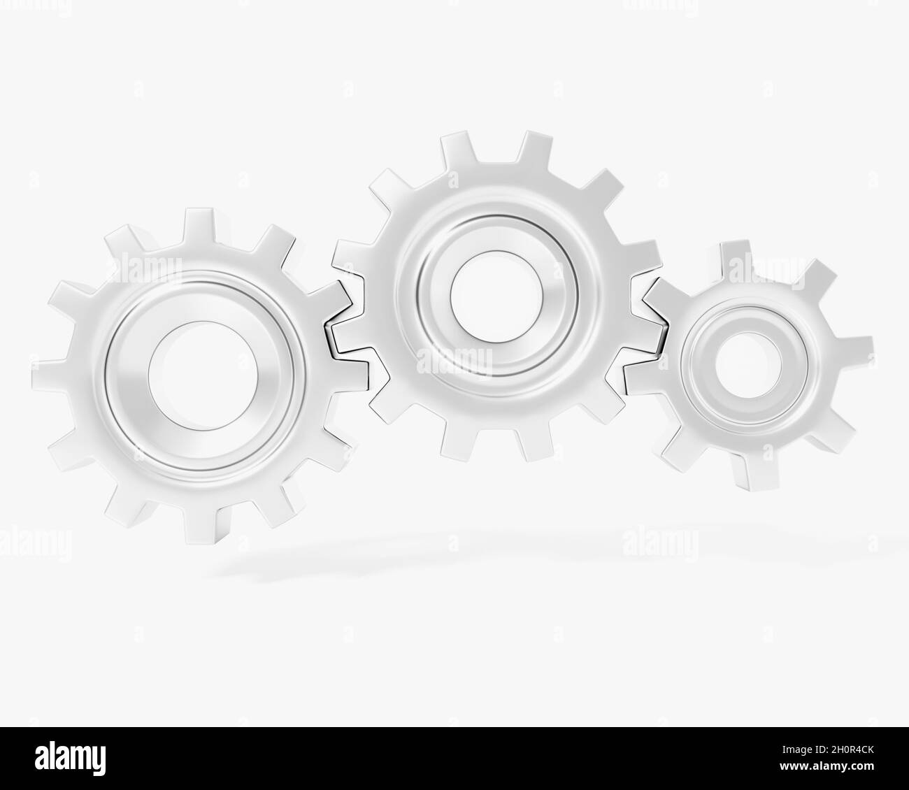 Three connecting metallic gear cogs of different sizes isolated on ...