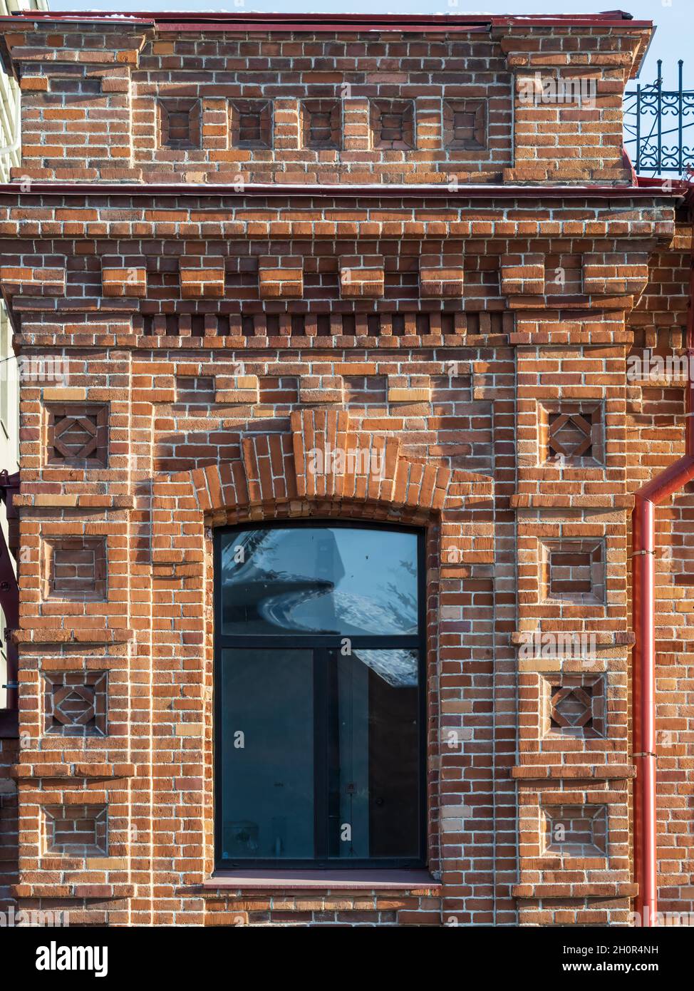The window of the old mansion 19 century with brown bricks wall. Brick ...