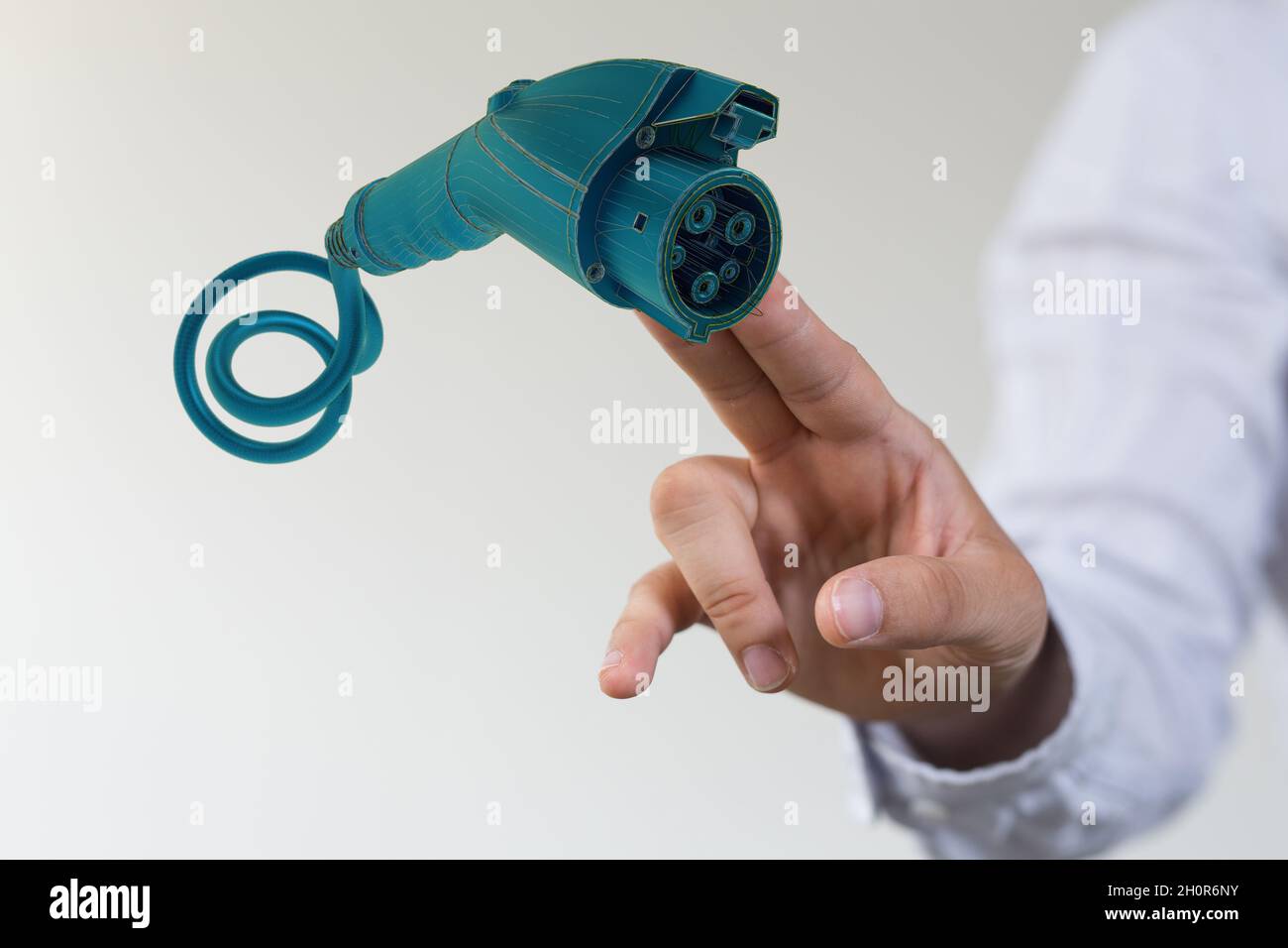 3D rendering of a man pointing at a floating electronic vehicle part ...