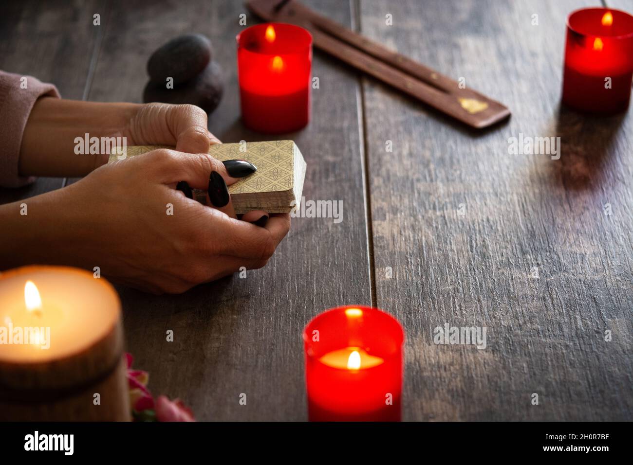 Fortune teller reading a future by tarot cards on rustic table Stock ...