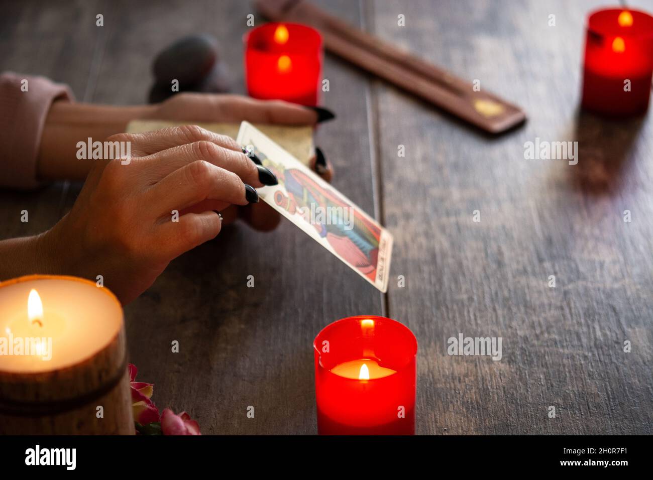 Fortune teller reading a future by tarot cards on rustic table Stock ...