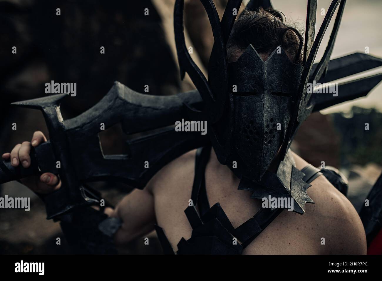 Portrait of man in image of daemon of death with wings behind his back ...