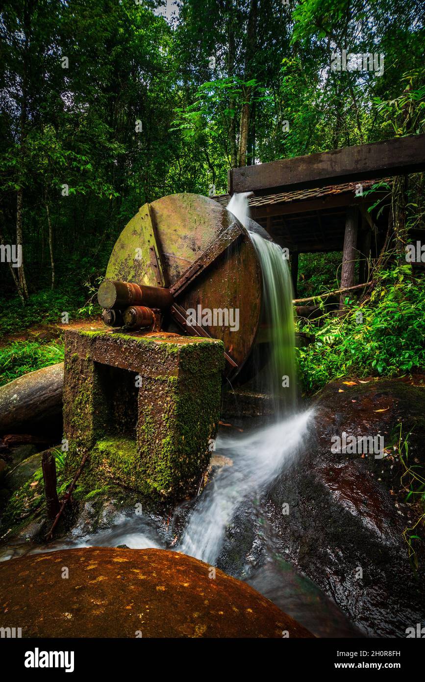 water wheel and cold water in stream in the forest Stock Photo - Alamy