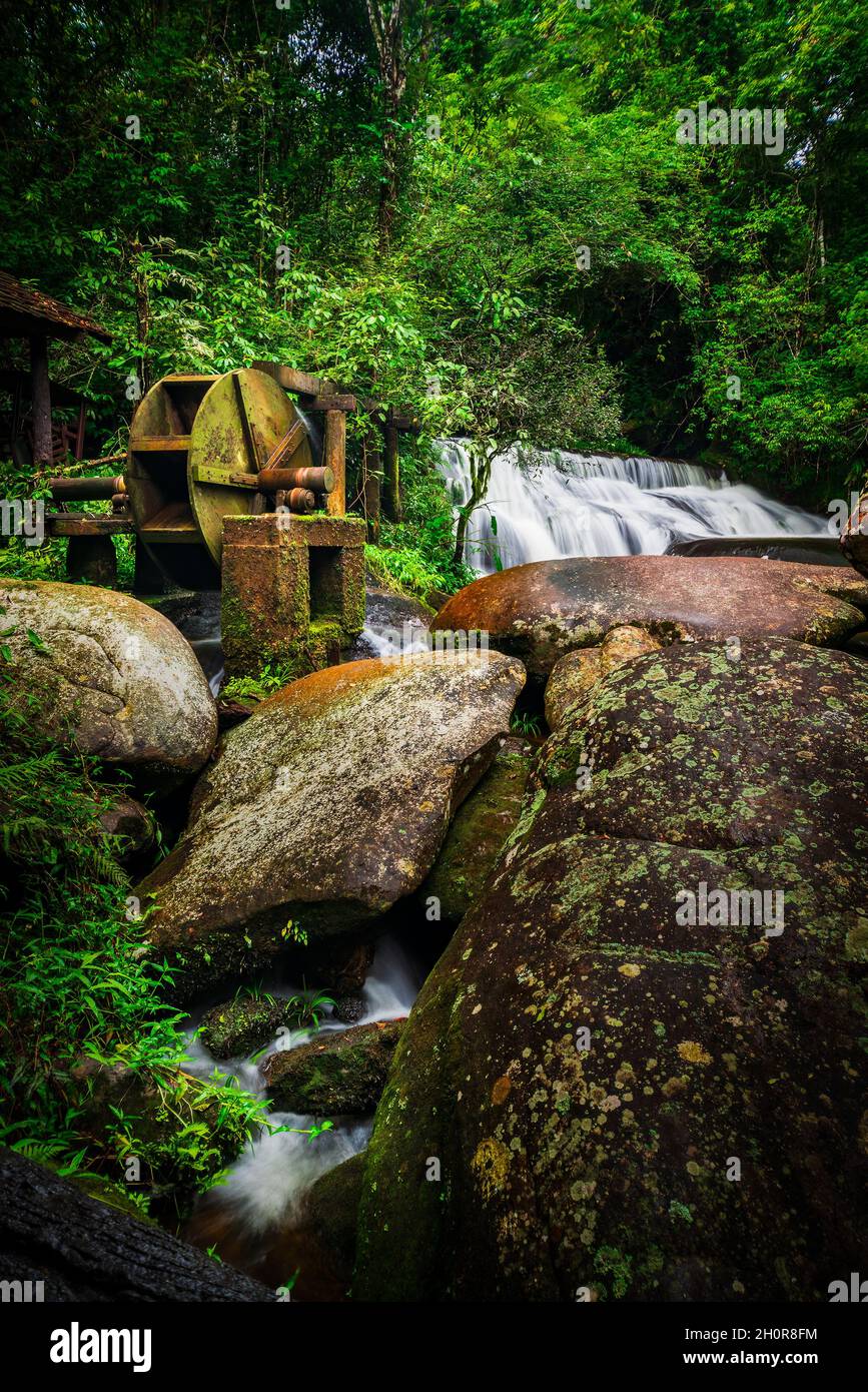 water wheel and cold water in stream in the forest Stock Photo - Alamy