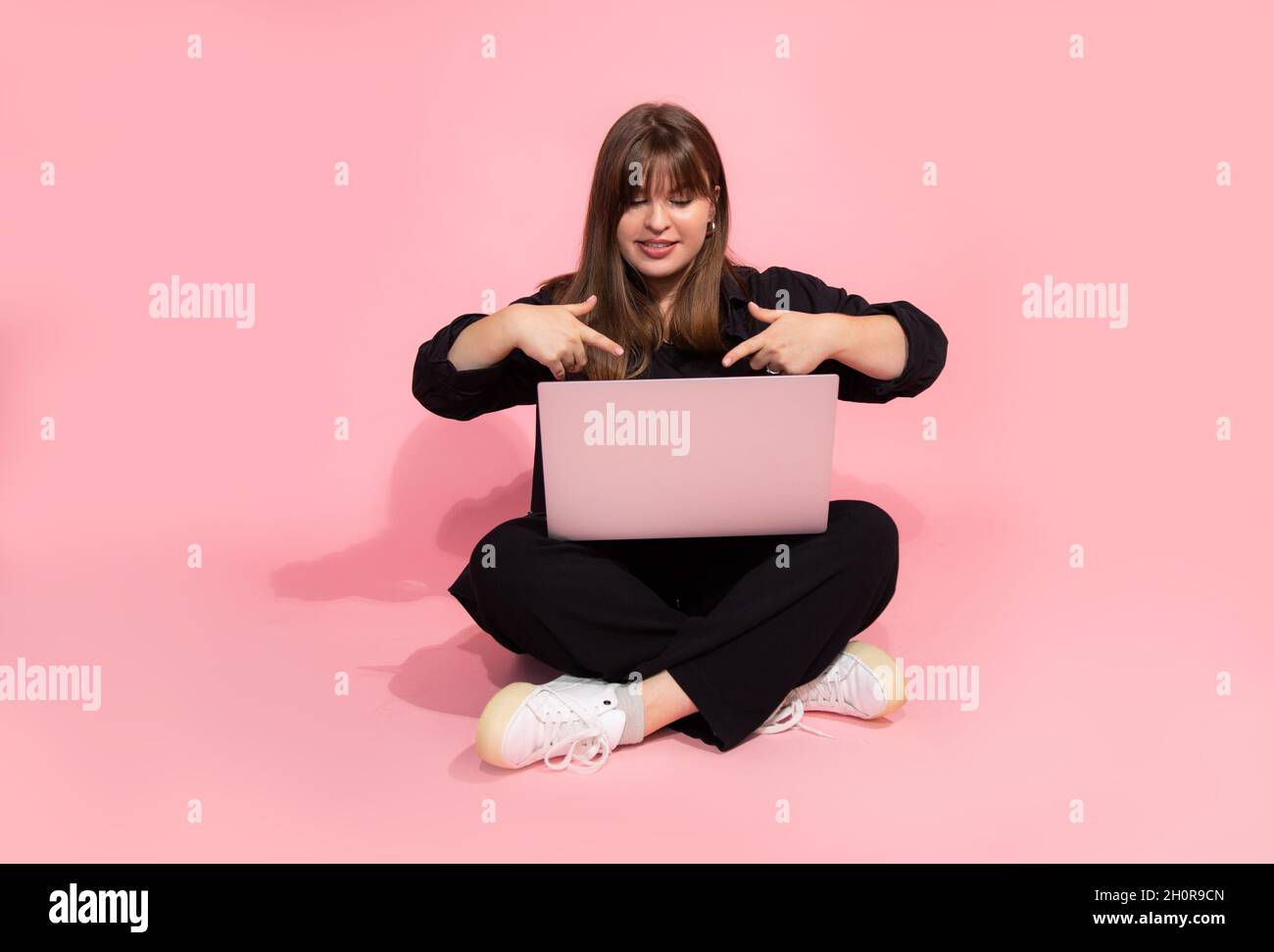 Student brown haired Girl in casual clothes Holding Laptop Computer ...