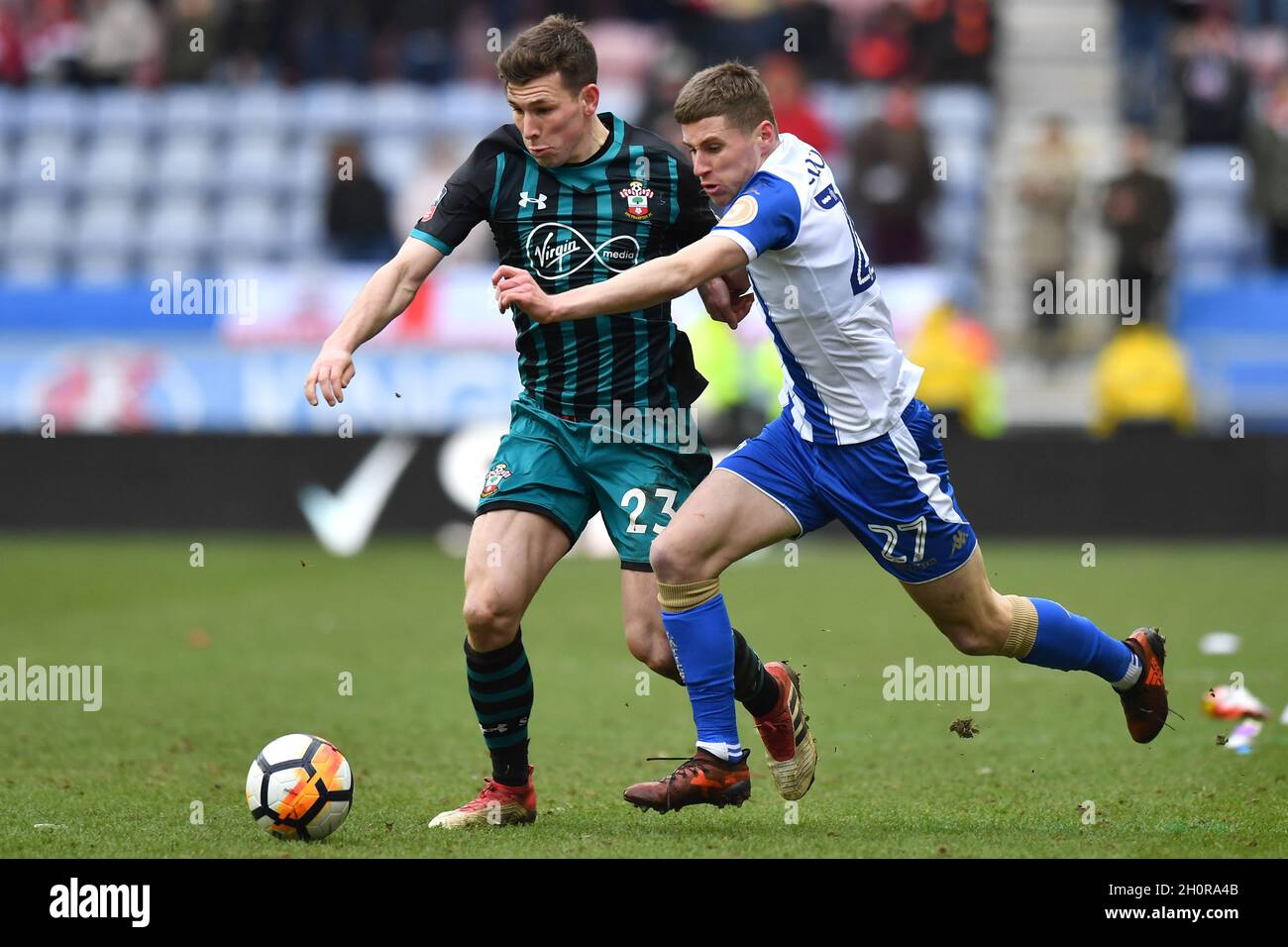 Southampton's Pierre-Emile Hojbjerg and Wigan Athletic’s Ryan Colclough ...
