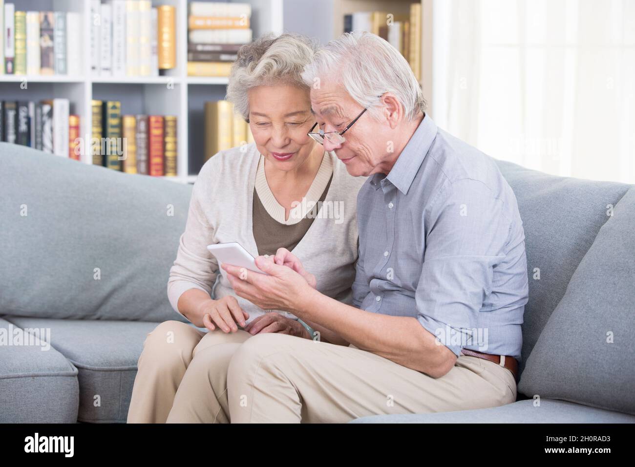 Old people in the East using a mobile phone Stock Photo - Alamy