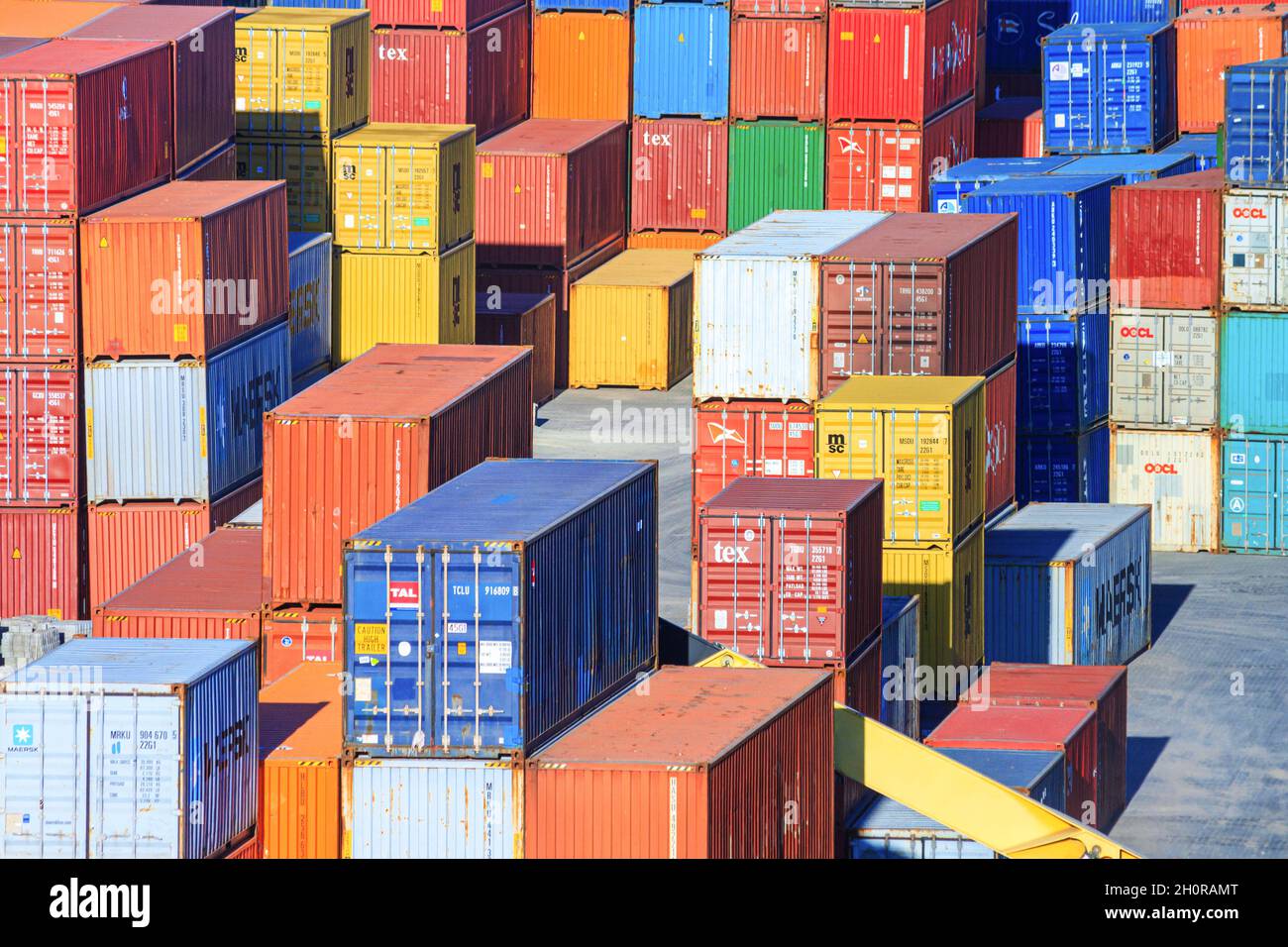 Stacked containers in the container terminal. Global transportation and ...