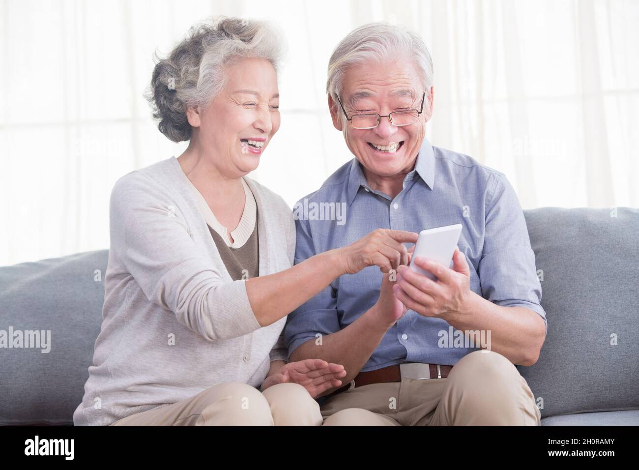 Old people in the East using a mobile phone Stock Photo - Alamy