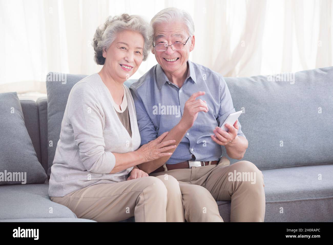 Old people in the East using a mobile phone Stock Photo - Alamy