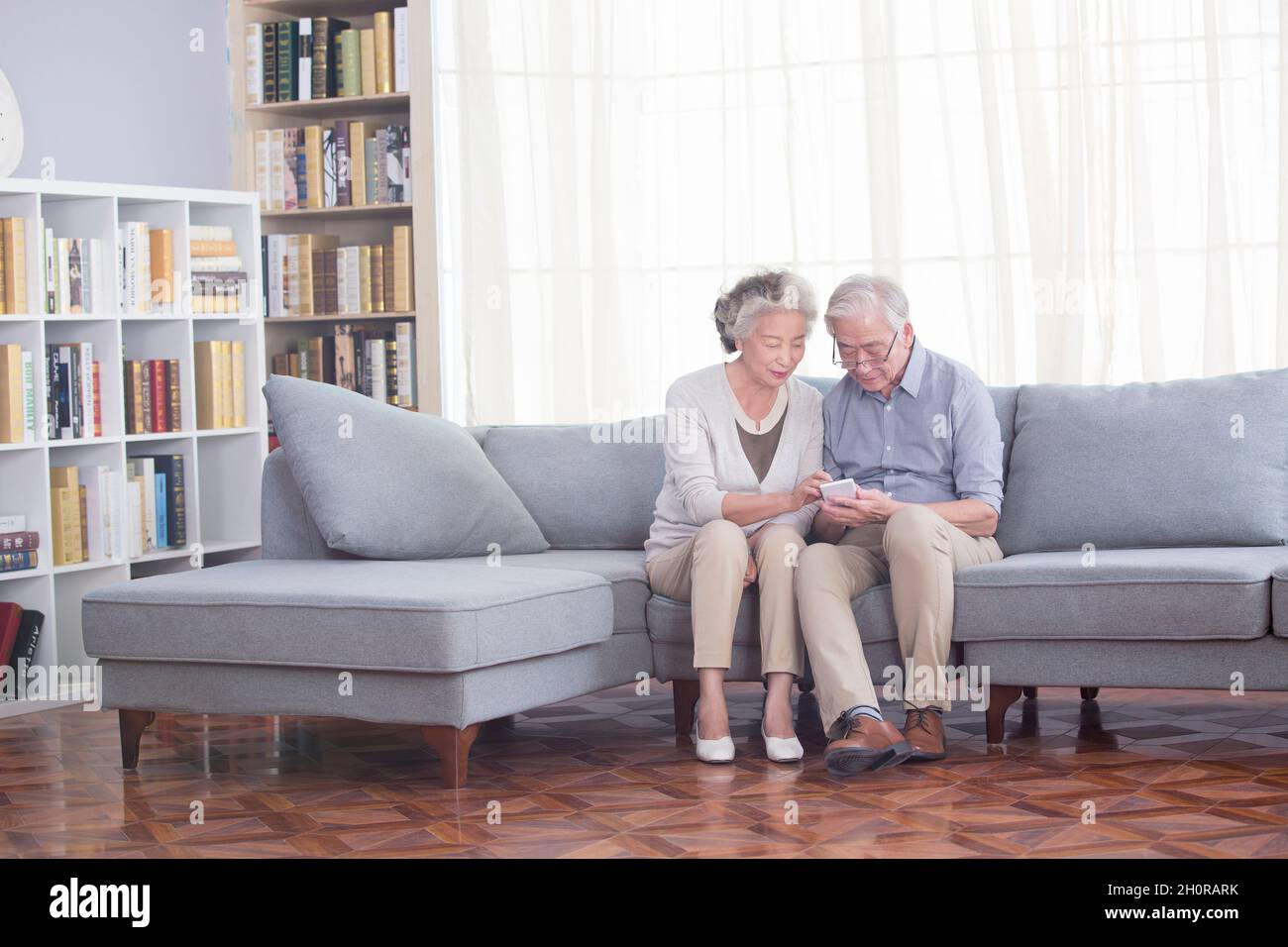 Old people in the East using a mobile phone Stock Photo - Alamy