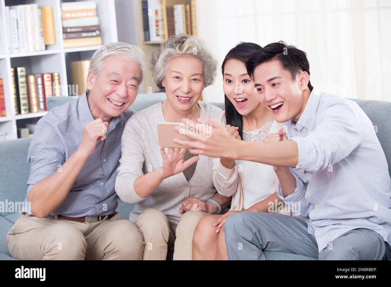 The happy family using their phones Stock Photo - Alamy