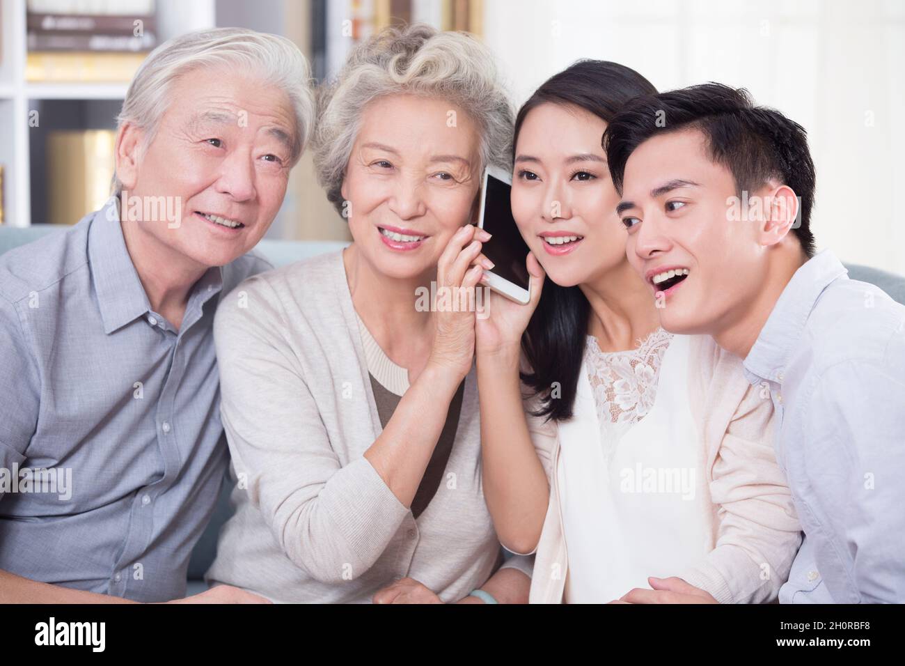 Happy young family four hi-res stock photography and images - Alamy