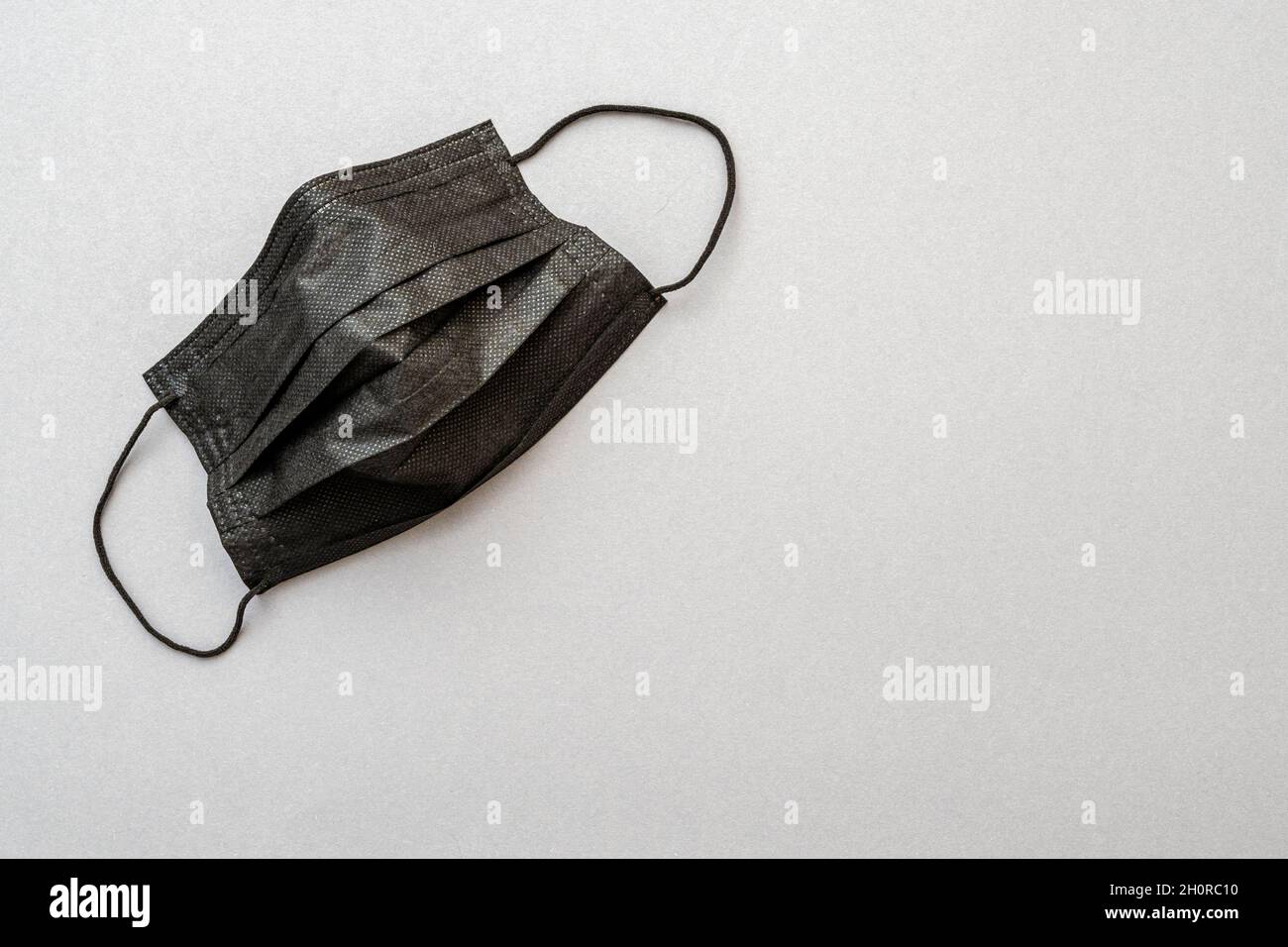 Black protective medical mask. Strong black mask for business office ...