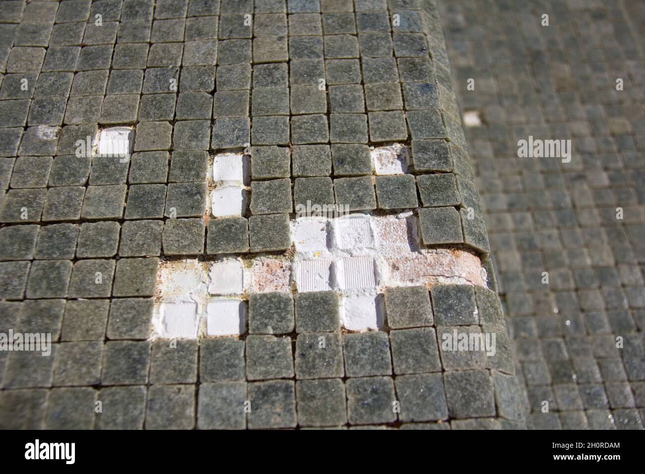 Missing tiles in a grey mosaic abandoned swimming pool Stock Photo - Alamy