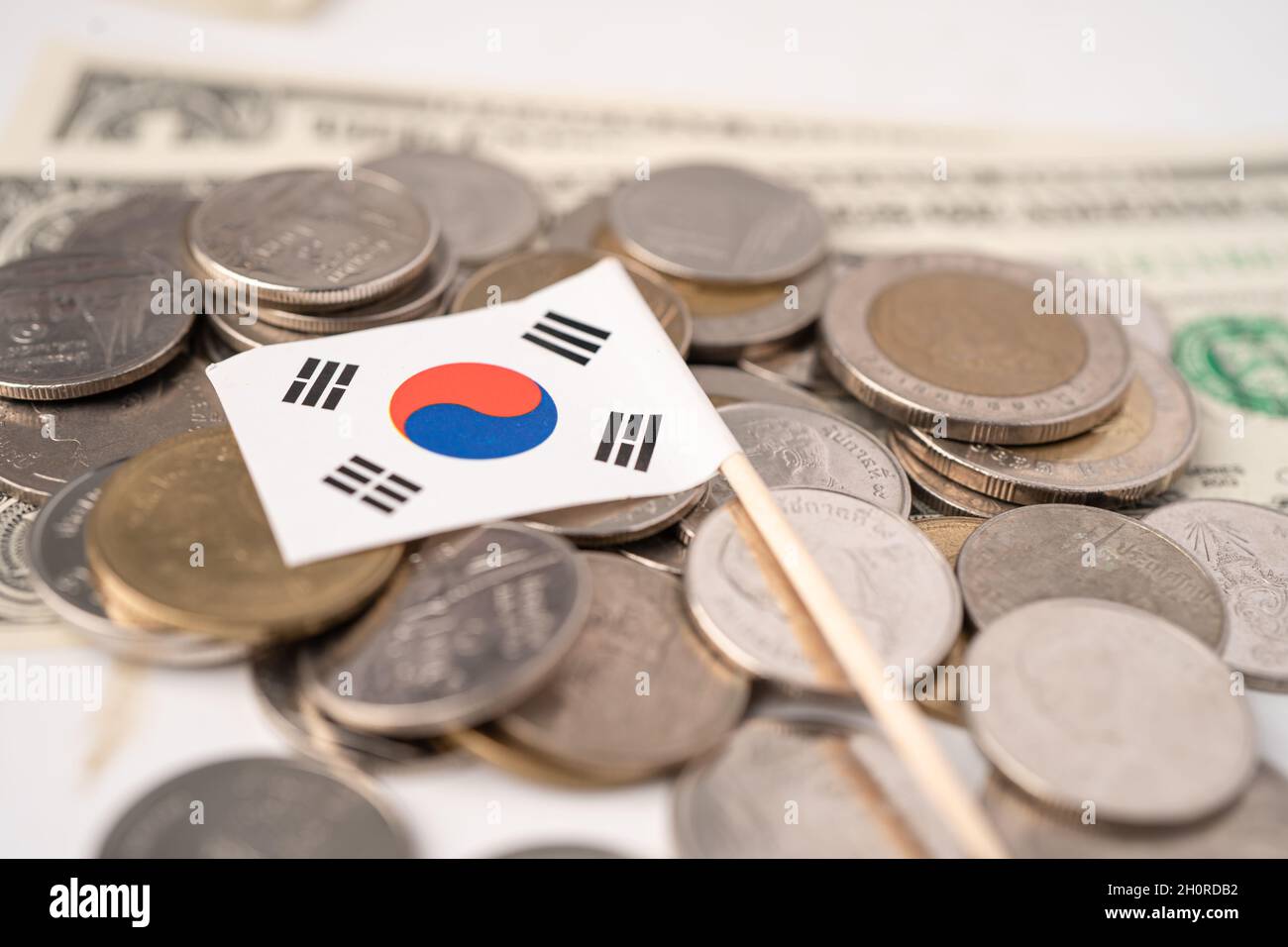 Stack of coins with Korea flag on white background. flag on white ...