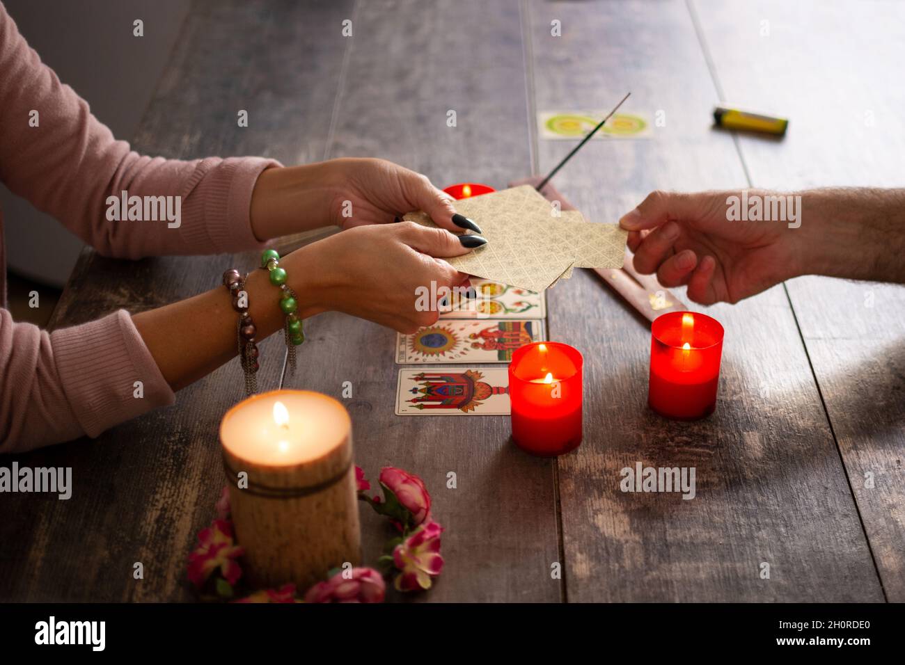 Fortune teller reading a future by tarot cards on rustic table Stock ...