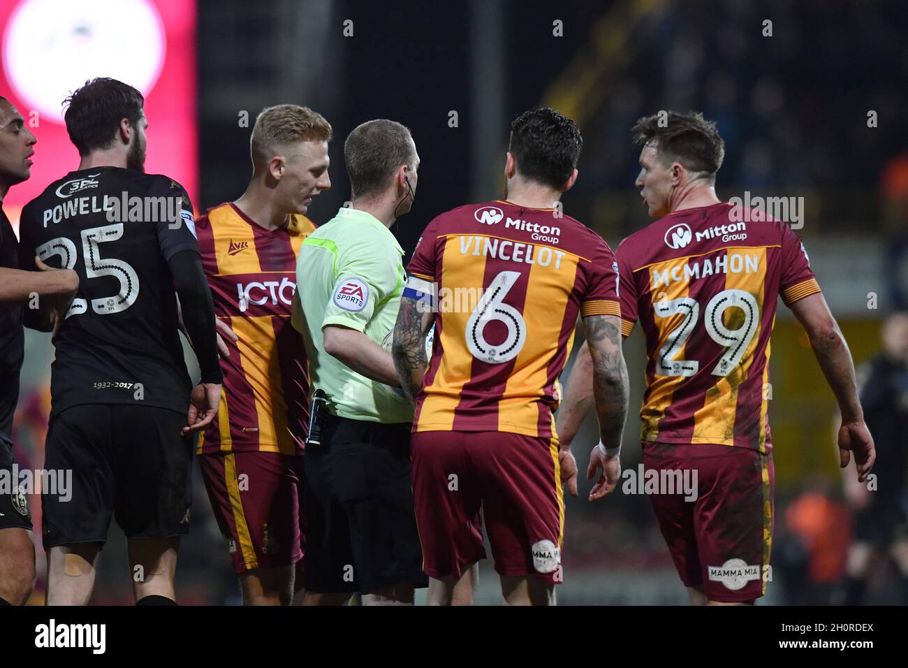 Match referee Martin Coy separates Wigan Athletic’s Nick Powell and ...