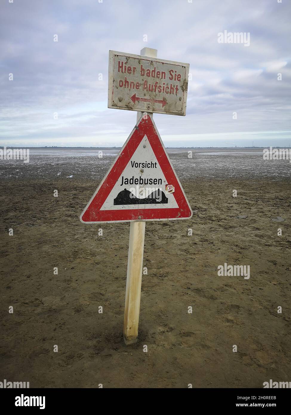 Warning sign on a wooden post saying "Swimming without supervision" at ...