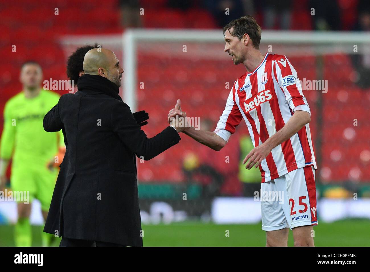 Manchester City manager Pep Guardiola shakes hands with Stoke City's ...
