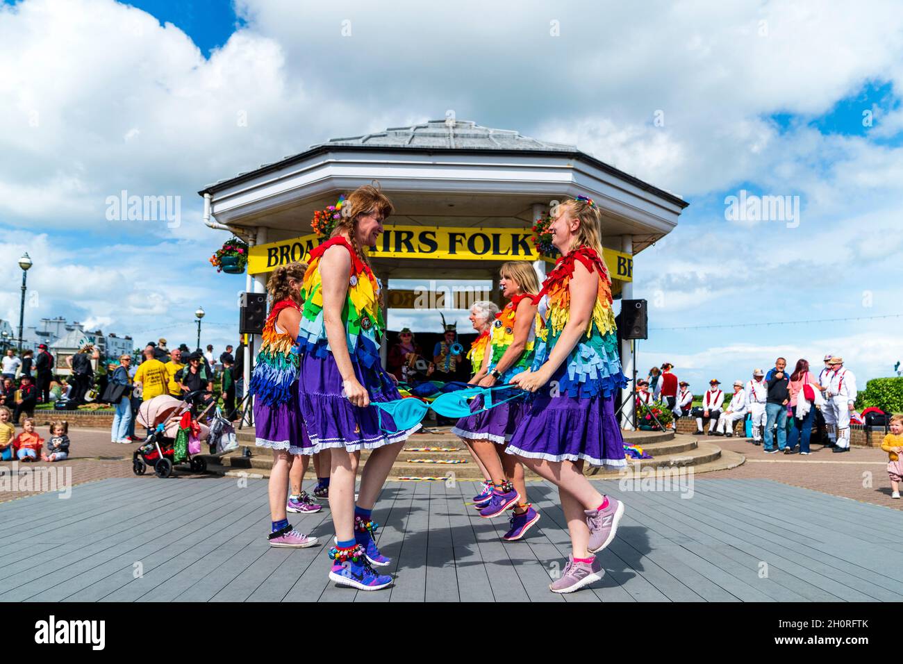 English folk dancers, the Loose Women Morris slide dancing while ...