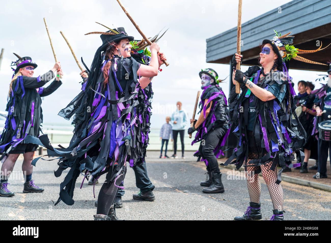 Black Swan Border Morris dancers in their black and mauve costume ...