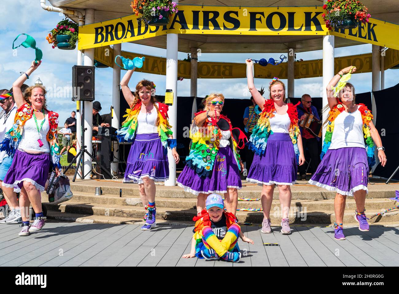 English folk dancers, the Loose Women Morris slide dancing while ...