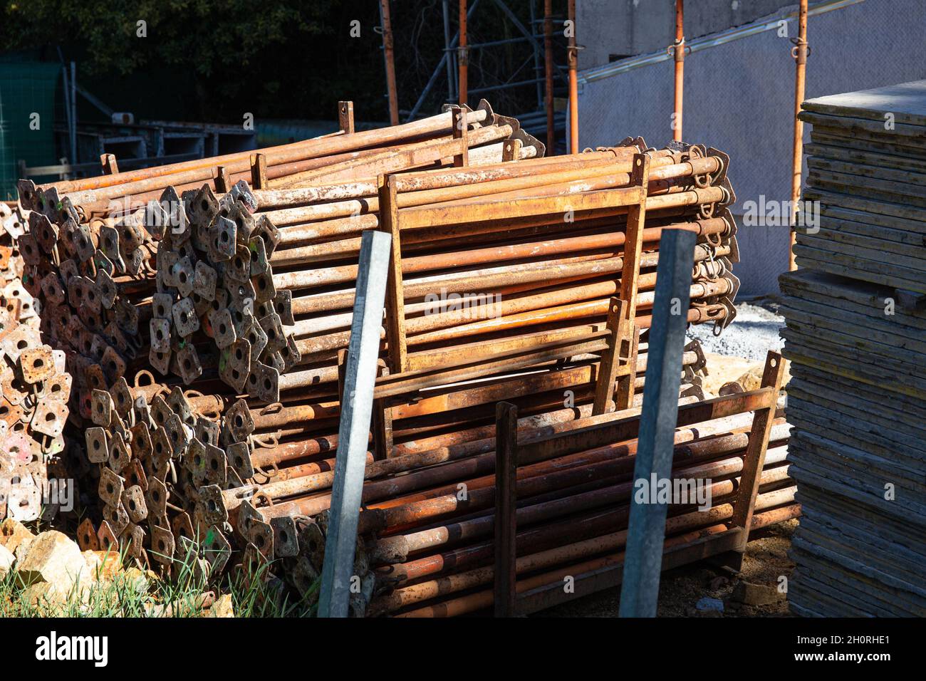 Pile of Metallic Struts on construction site Stock Photo - Alamy