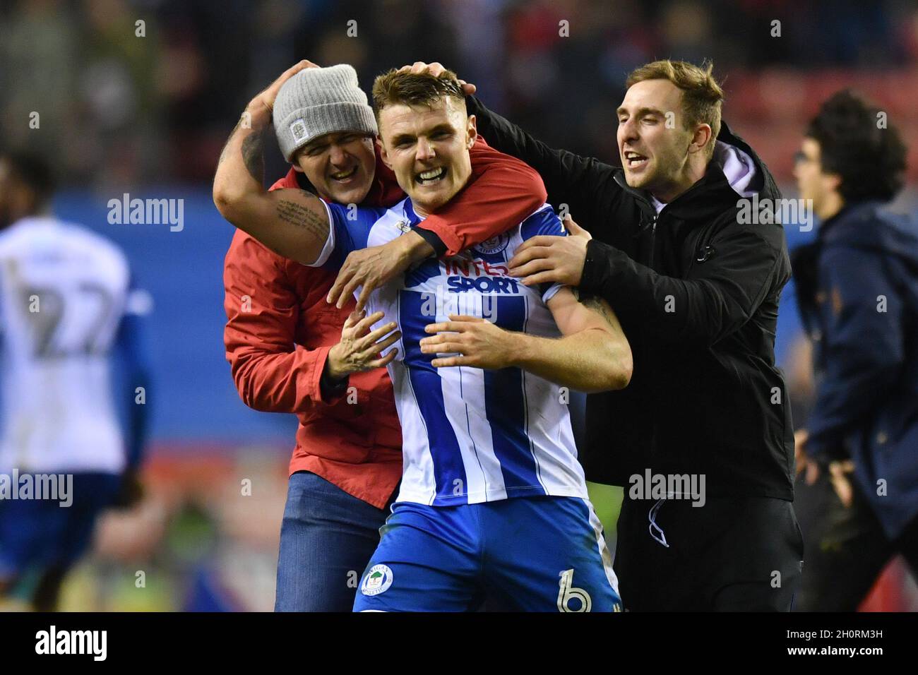 Wigan Athletic’s Max Power celebrates as Wigan fans invade the pitch at ...