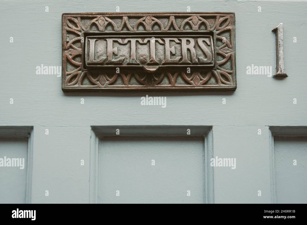 Close-up of metal letterbox with the word letters and the number 1 ...