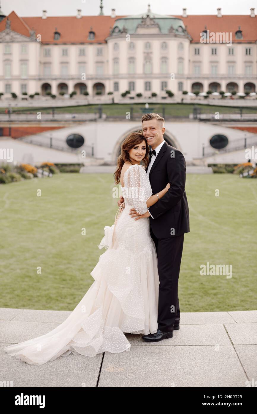 photo of bride and groom in full-length wedding dress standing in ...