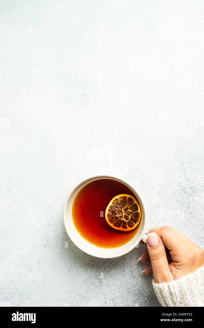 Overhead view of a woman enjoying a cup of tea Stock Photo - Alamy
