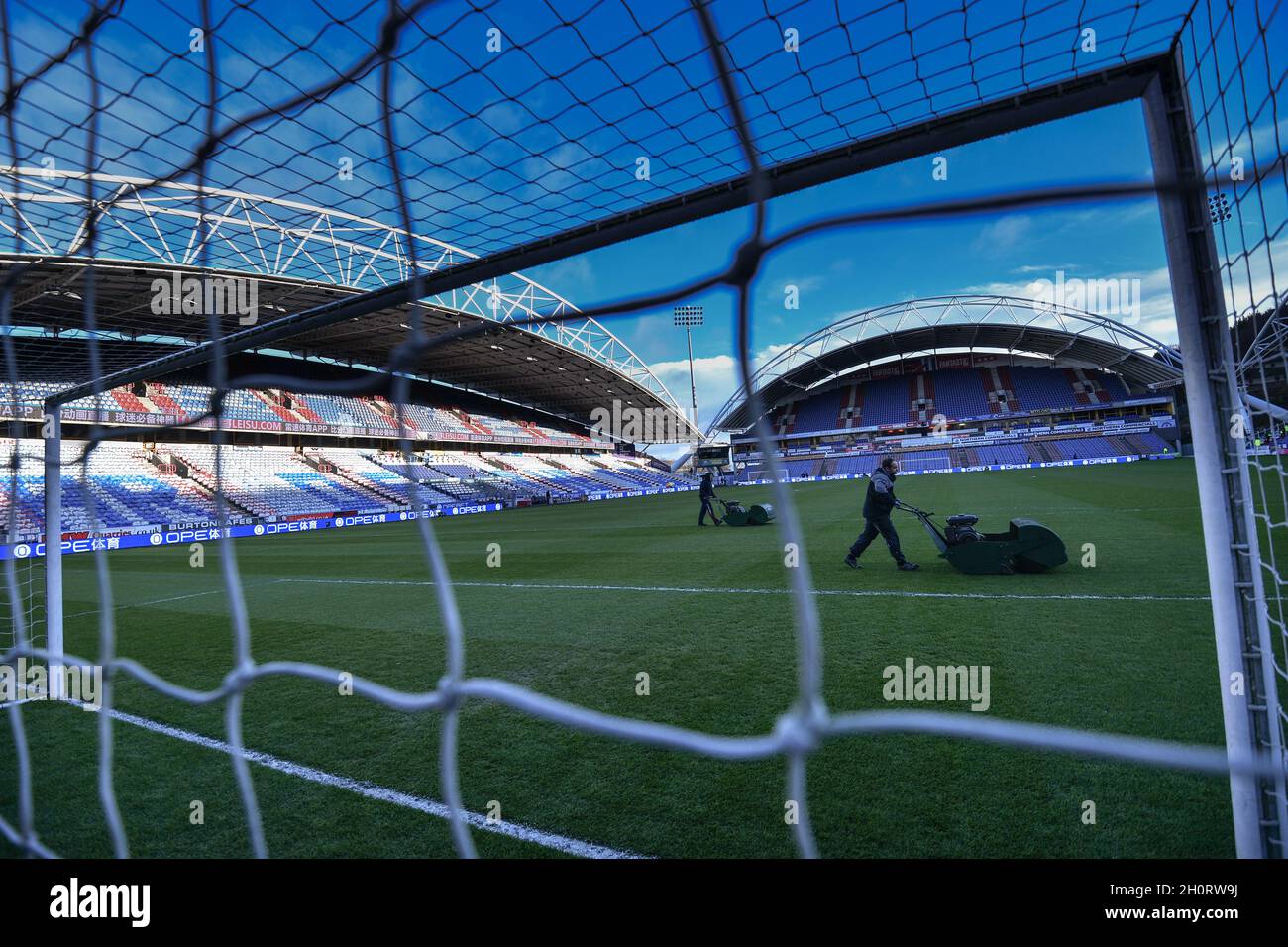 Ground staff prepare the pitch ahead of kick-off Stock Photo - Alamy