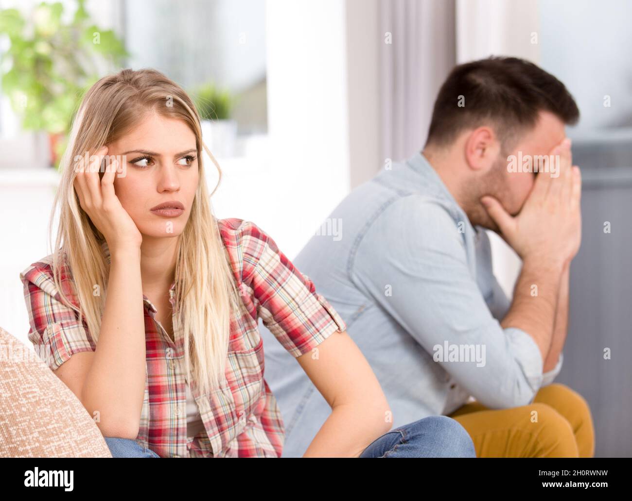 Young couple having problems in relationship, arguing and feeling sad ...