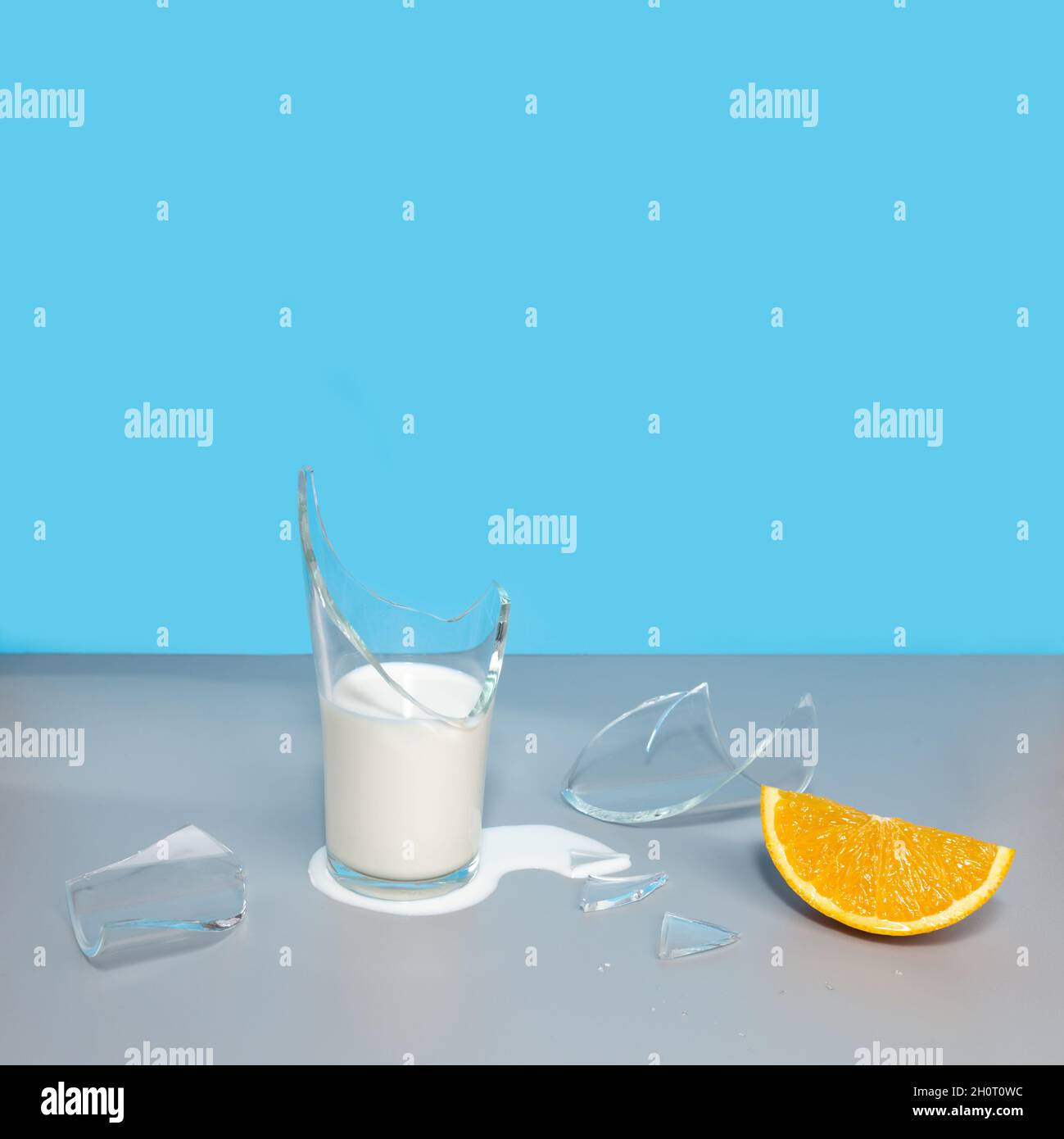 broken glass with milk, against lactose concept Stock Photo - Alamy