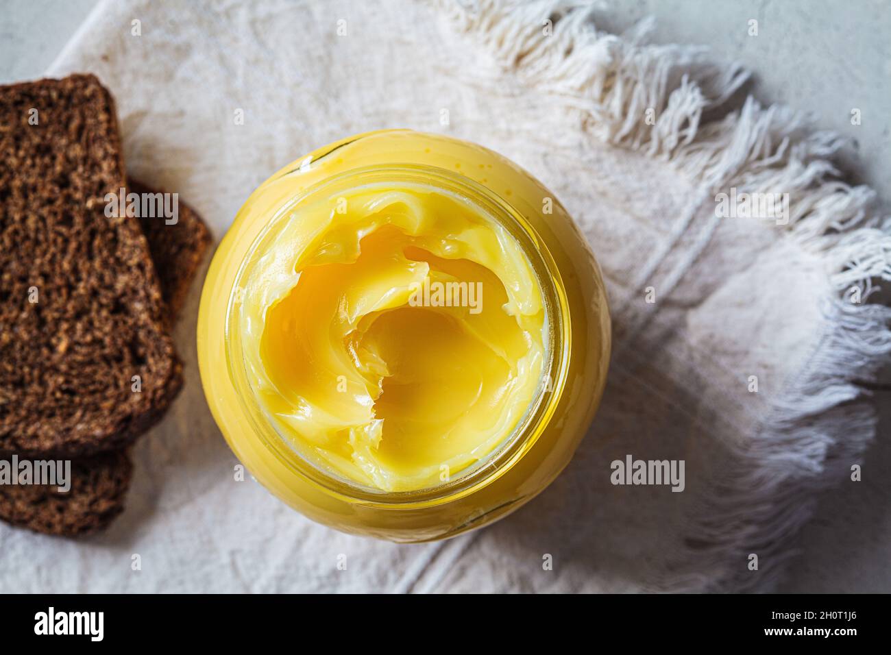 Ghee butter in a glass jar, top view Stock Photo - Alamy