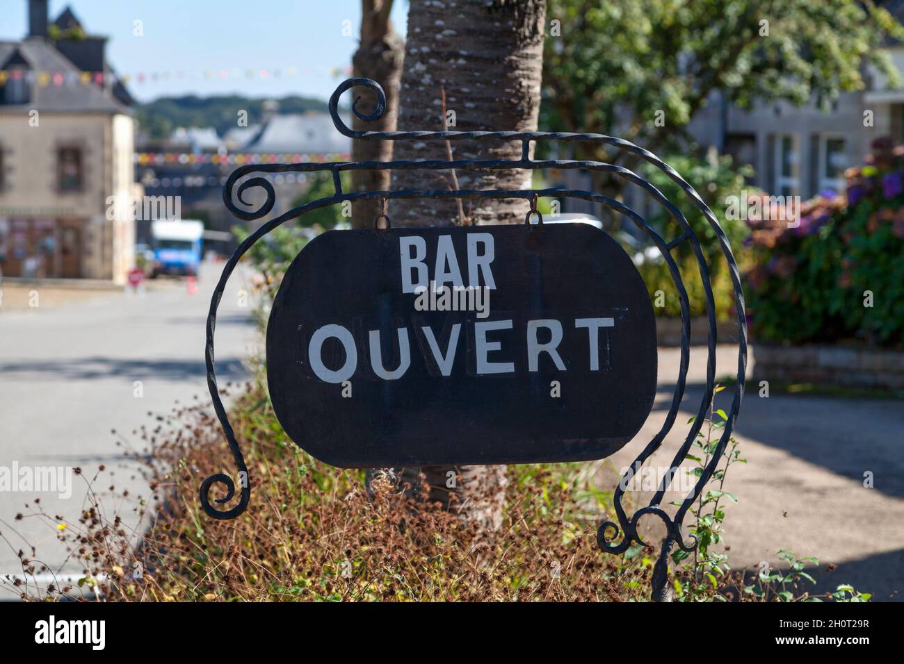 Close up On An Outdoor Sign Saying In French Bar Ouvert Meaning In English Bar Open Stock close-up-on-an-outdoor-sign-saying-in-french-bar-ouvert-meaning-in-english-bar-open-stock