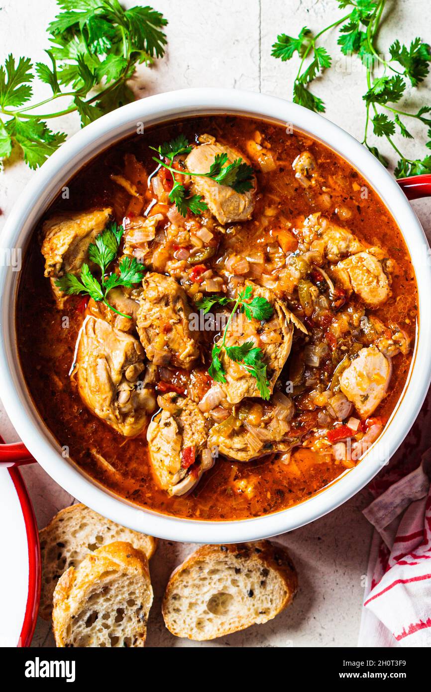Chicken stew with tomato sauce - Chahohbili in pot, top view. Georgian ...