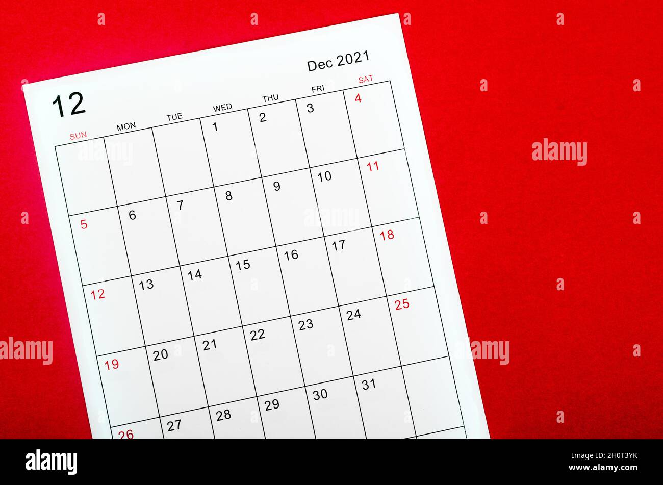 Close up december 2021 calendar sheet on red dark background Stock ...
