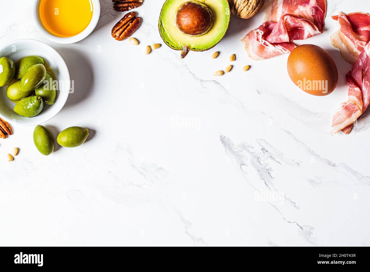 Keto diet ingredients frame on white marble background, copy space ...