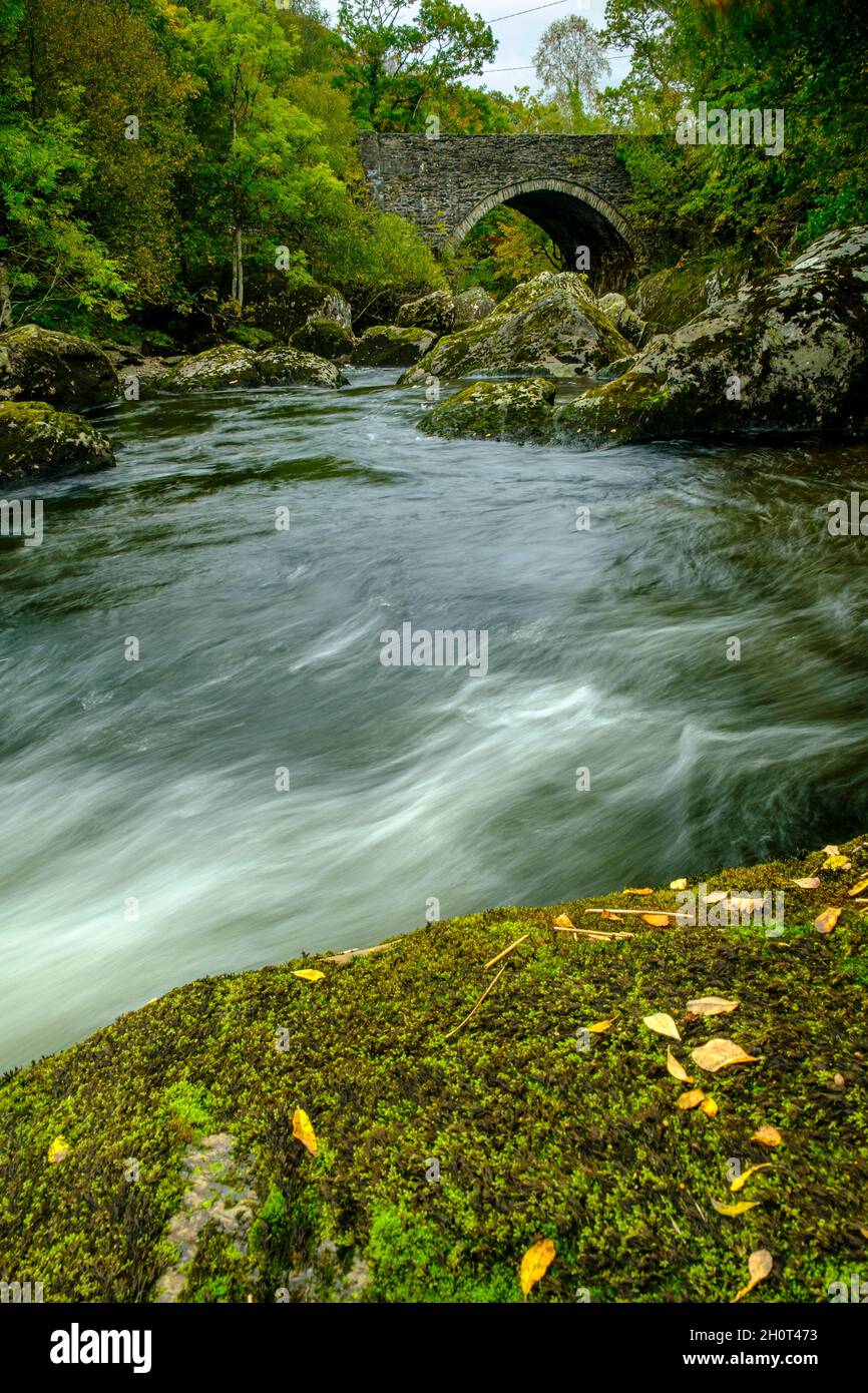 The River Llugwy flowing under the stone bridge at Pony Cyfnyg in Capel ...