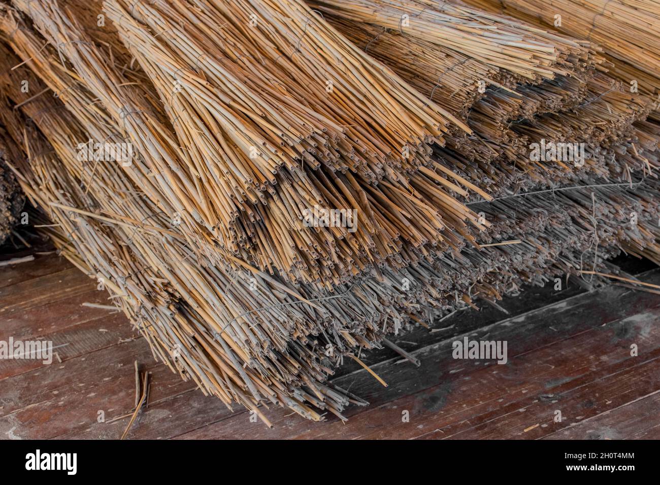 Straw rope dry reed natural material is stored in rolls Stock Photo - Alamy