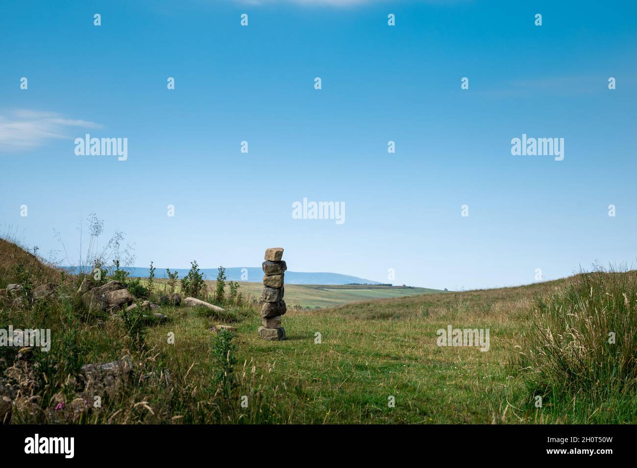 Stacked stone wayfinder in Northumberland countryside Stock Photo - Alamy