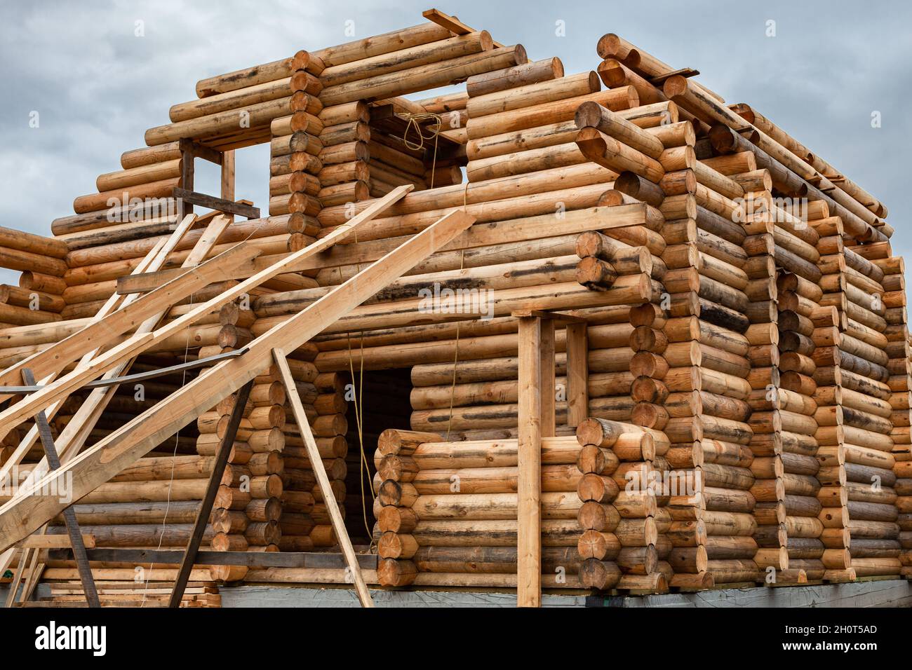 a wooden house under construction a log house consisting of two floors ...